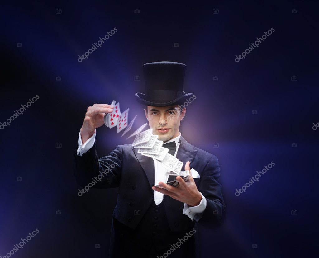 Magician showing trick with playing cards — Stock Photo © Syda ...