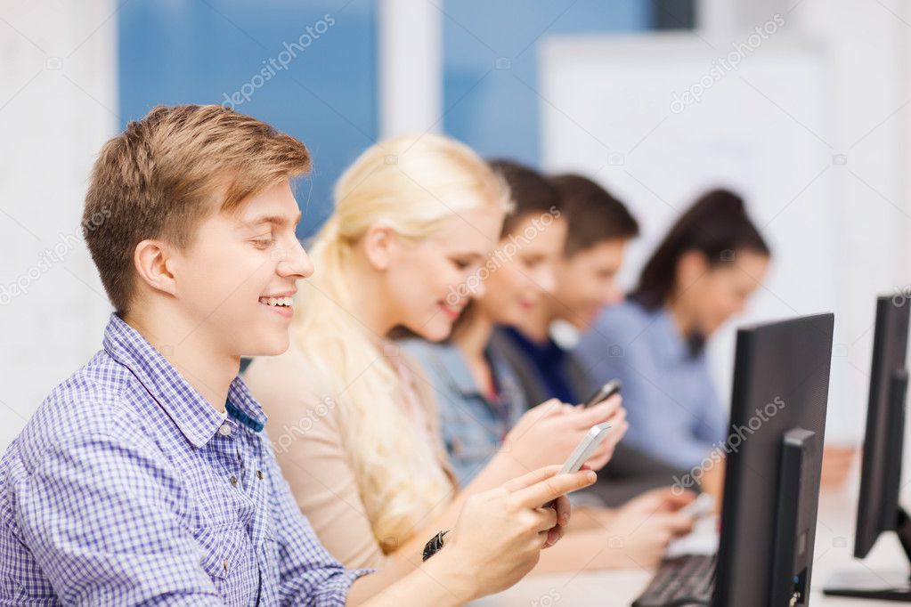 Students with computer monitor and smartphones — Stock Photo © Syda ...