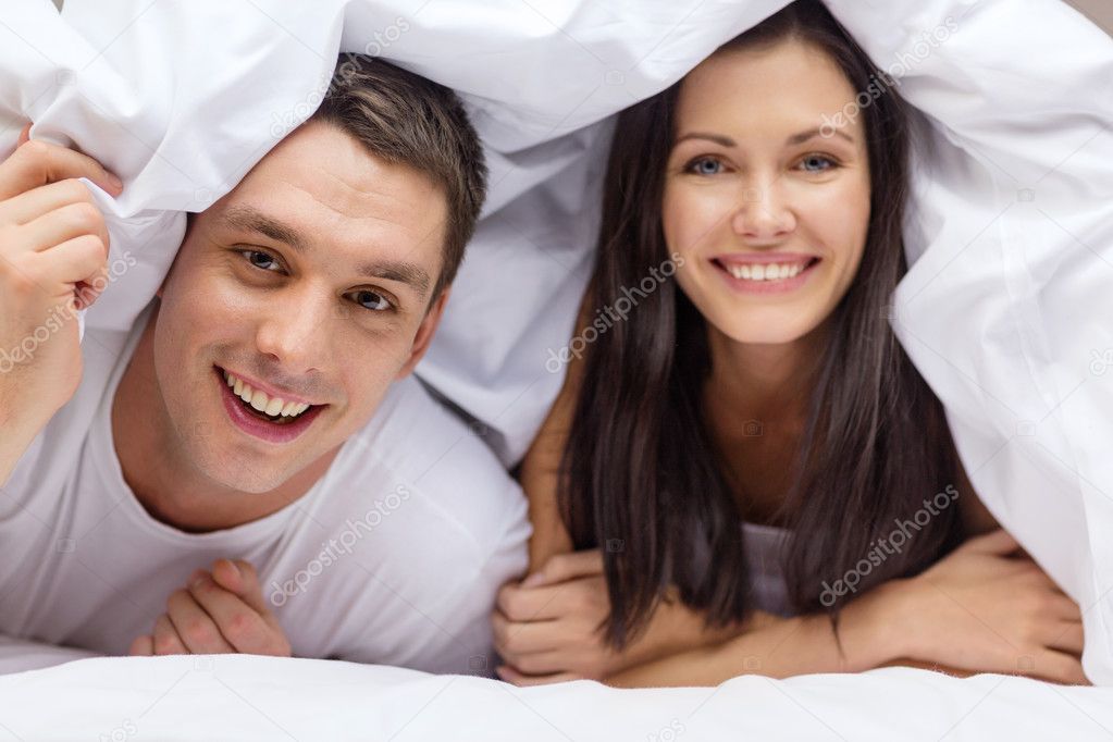 Happy couple sleeping in bed — Stock Photo © Syda_Productions #37405715