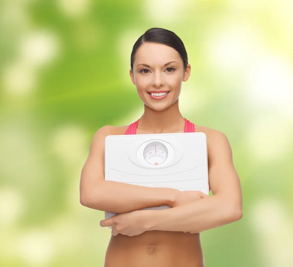 Woman with scale - Stock Image - Everypixel