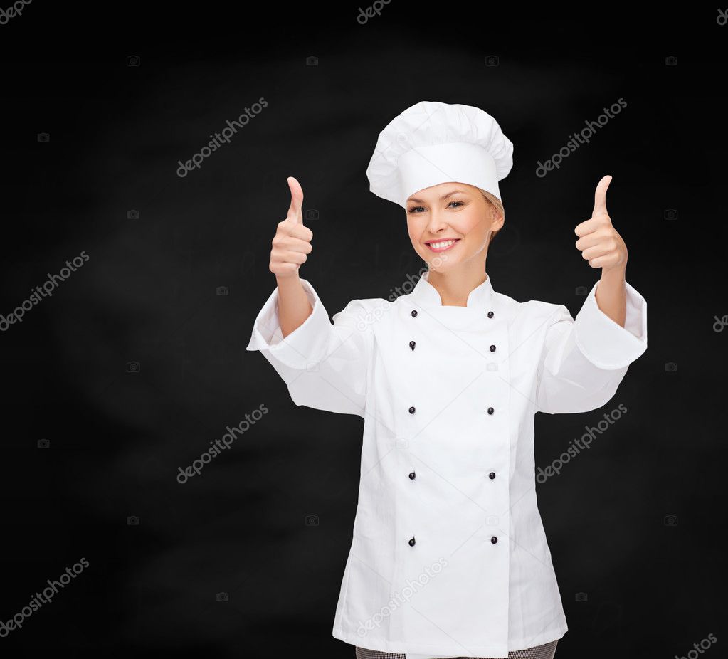 Smiling female chef showing thumbs up — Stock Photo © Syda_Productions ...