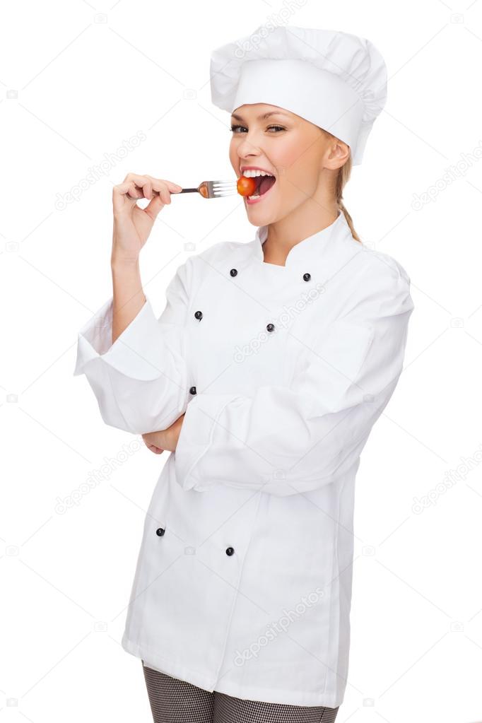 Female chef, cook or baker with fork and tomato — Stock Photo © Syda ...