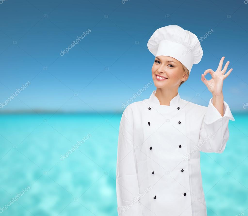 Smiling female chef showing ok hand sign — Stock Photo © Syda ...