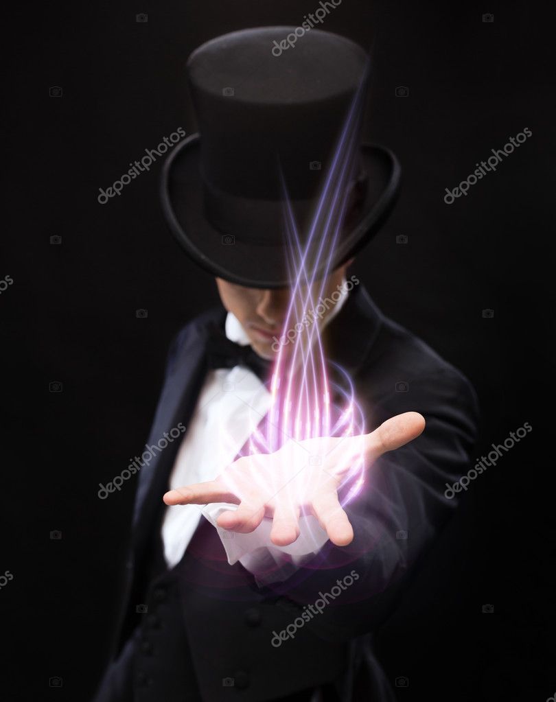 Magician holding something on palm of his hand Stock Photo by ©Syda ...