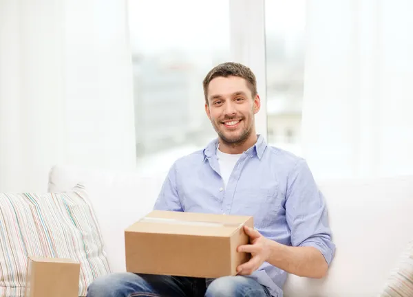 Man with cardboard boxes at home - Stock Image - Everypixel