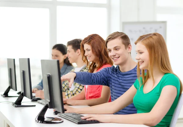 female student with classmates in computer class - Stock Image - Everypixel