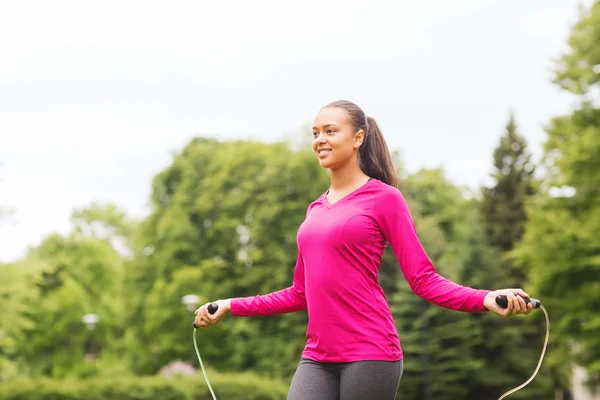 Smiling young woman running outdoors — Stock Photo © Syda_Productions ...