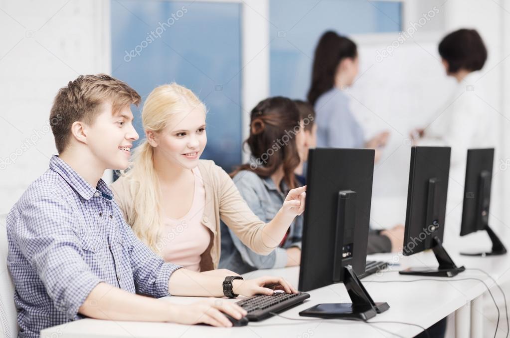 Students with computer monitor at school — Stock Photo © Syda ...