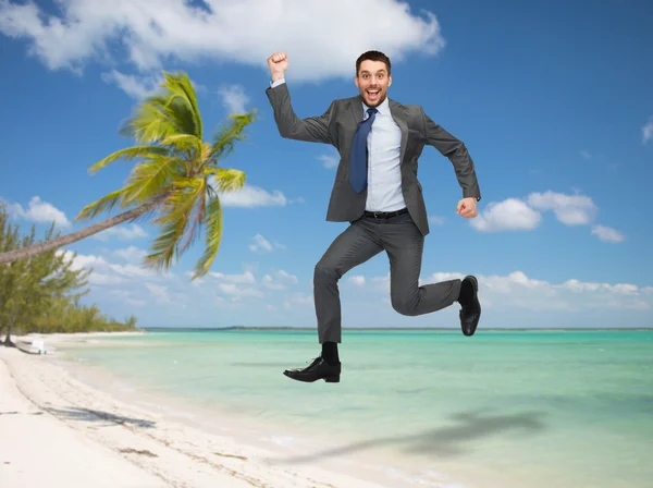 smiling happy businessman jumping - Stock Image - Everypixel