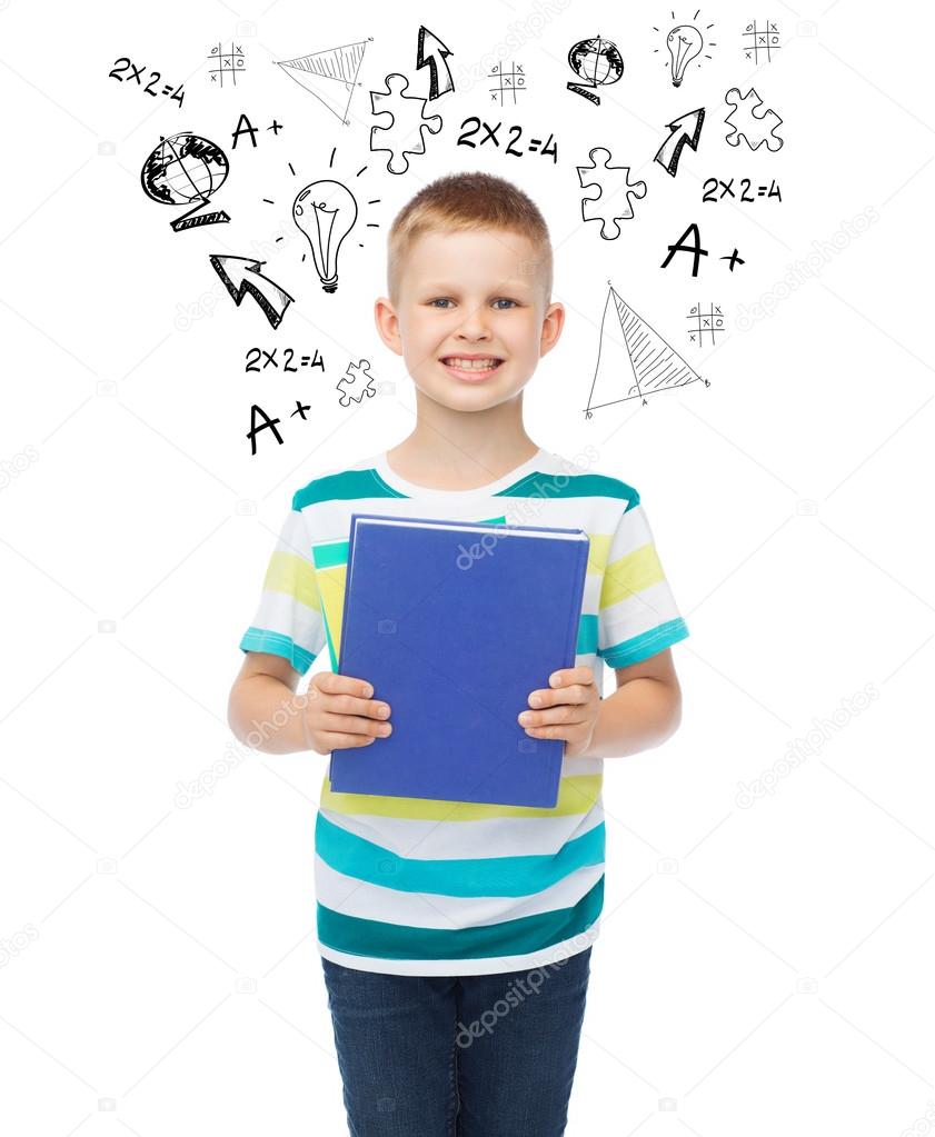 Smiling little student boy with blue book Stock Photo by ©Syda ...