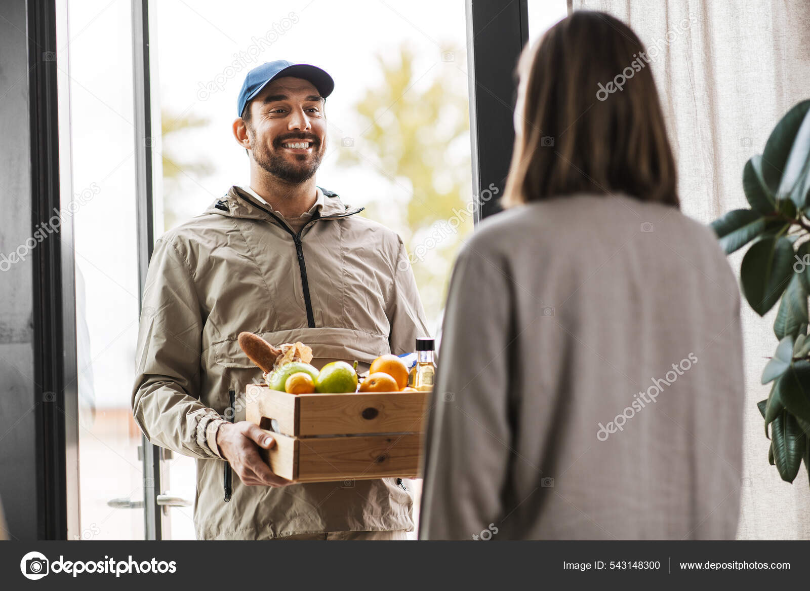 Food delivery man giving order to female customer Stock Photo by ©Syda ...