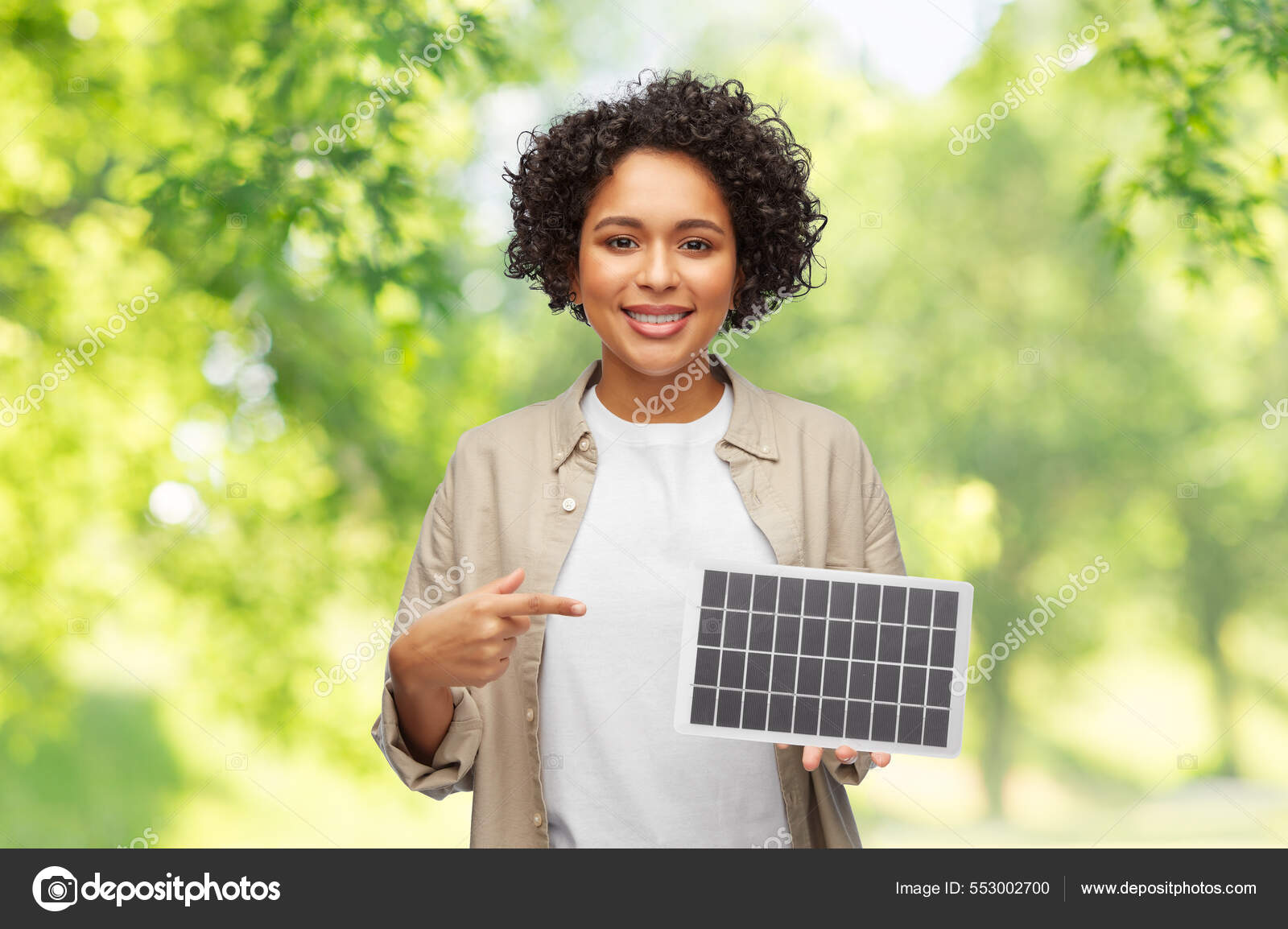 Happy smiling woman showing solar battery model — Stock Photo © Syda ...