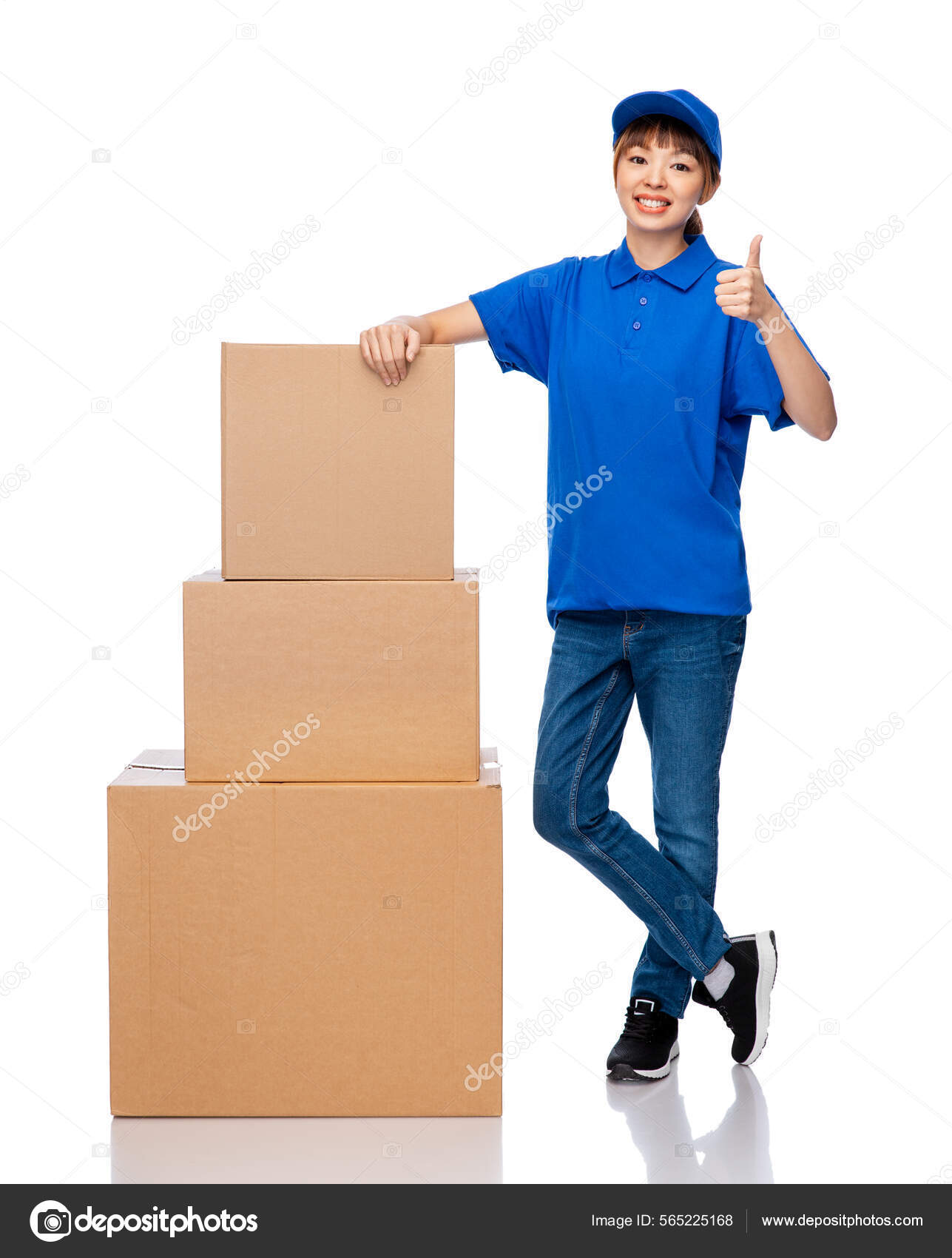Delivery woman in blue uniform with parcel boxes Stock Photo by ©Syda ...