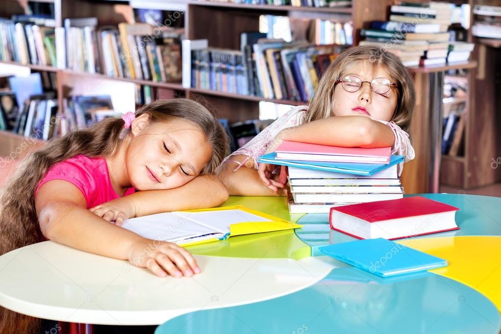 Kids asleep in a library Stock Photo by ©anatols 20350231