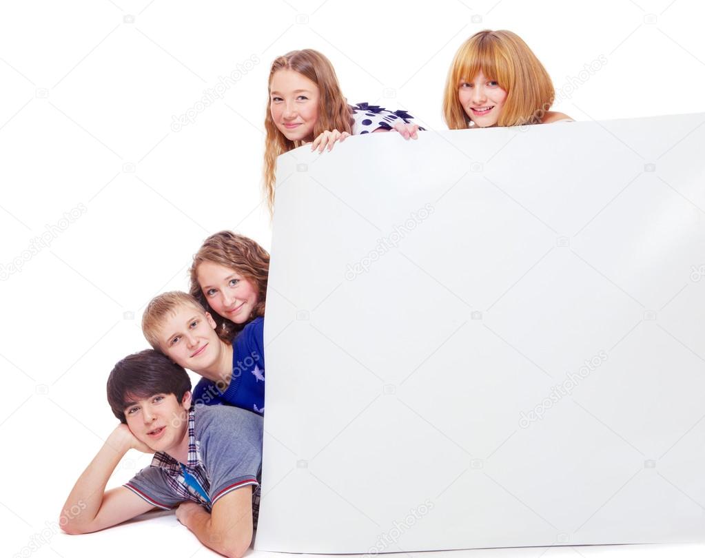 Teenagers hide behind paper Stock Photo by ©anatols 35861177