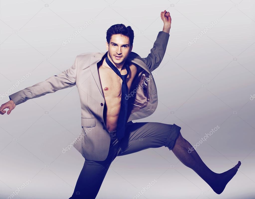 Handsome man in victorious jump — Stock Photo © konradbak #25108393