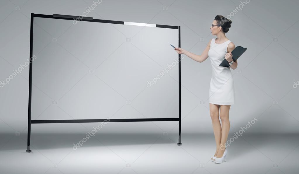 Business woman explain at the whiteboard Stock Photo by ©konradbak 38928267