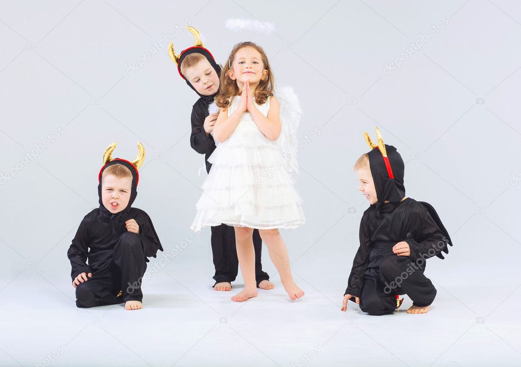 Little angel and three devils — Stock Photo © konradbak #41188421