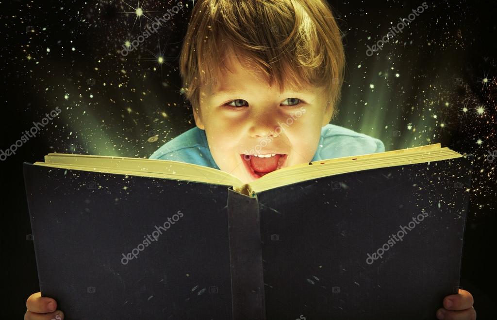 Small boy carrying a magic book — Stock Photo © konradbak #41194273