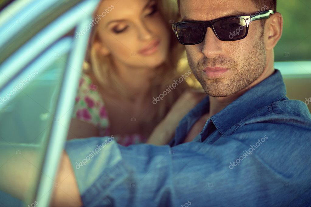 Serious handsome man and his lovely girlfriend — Stock Photo ... Serious handsome man and his lovely girlfriend — Stock Photo ...