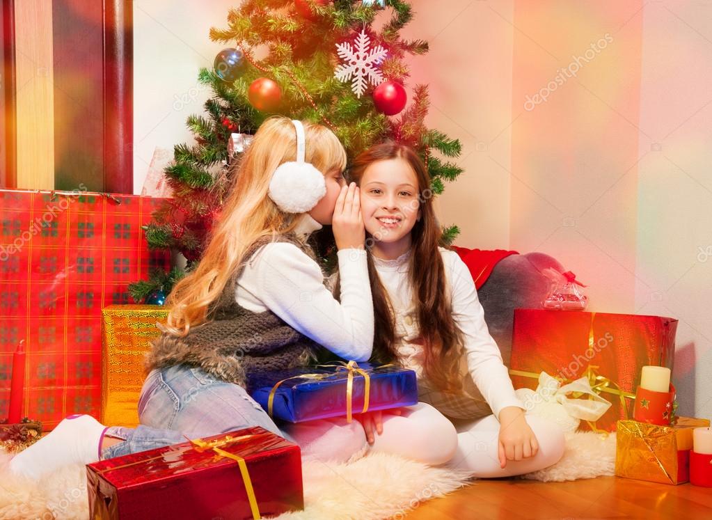 Two girls sharing secrets Stock Photo by ©serrnovik 16295523