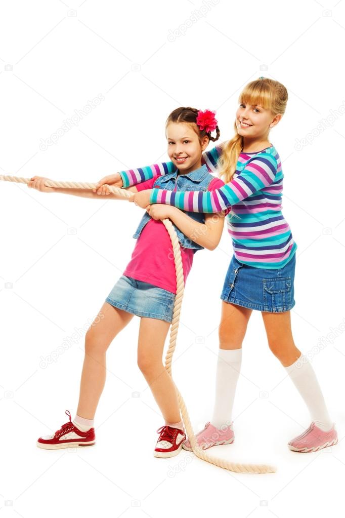 Girls team pulling the rope — Stock Photo © serrnovik #24687597