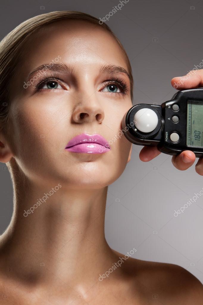 Measuring light with flash meter Stock Photo by ©serrnovik 28465873