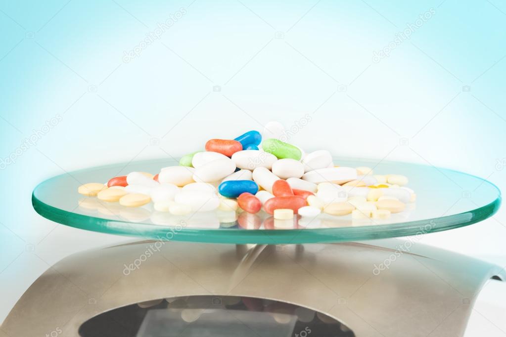 Scales with tablets — Stock Photo © serrnovik #28469239