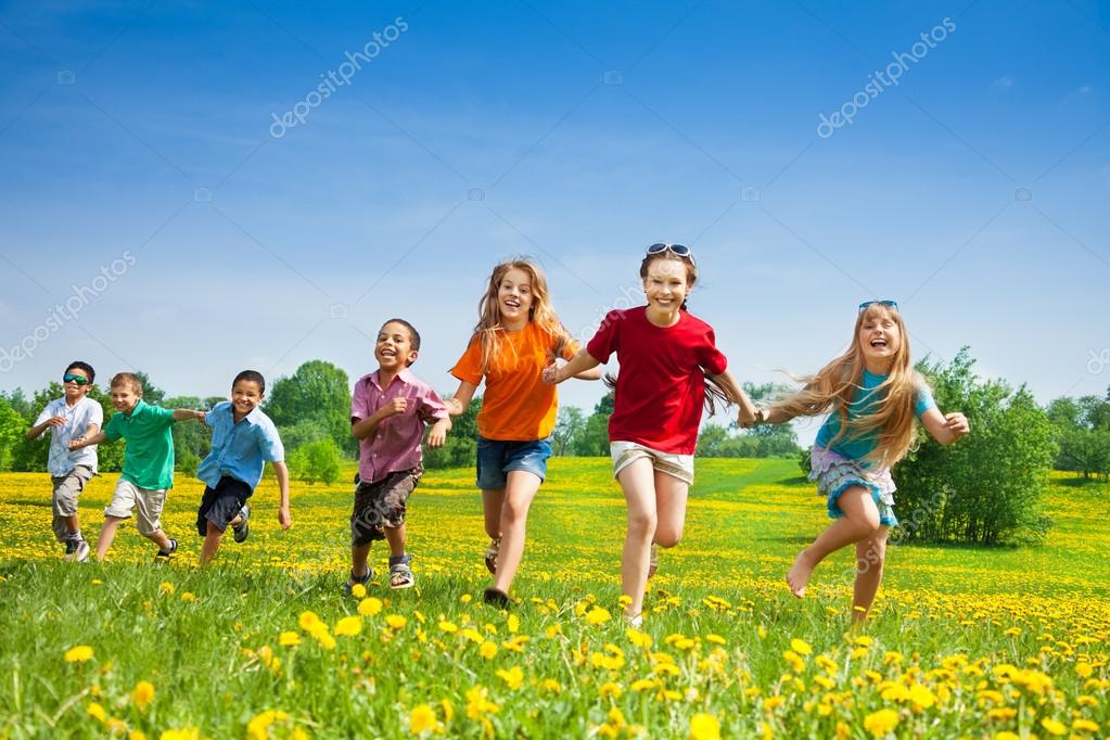 Kids running in the field Stock Photo by ©serrnovik 28480817