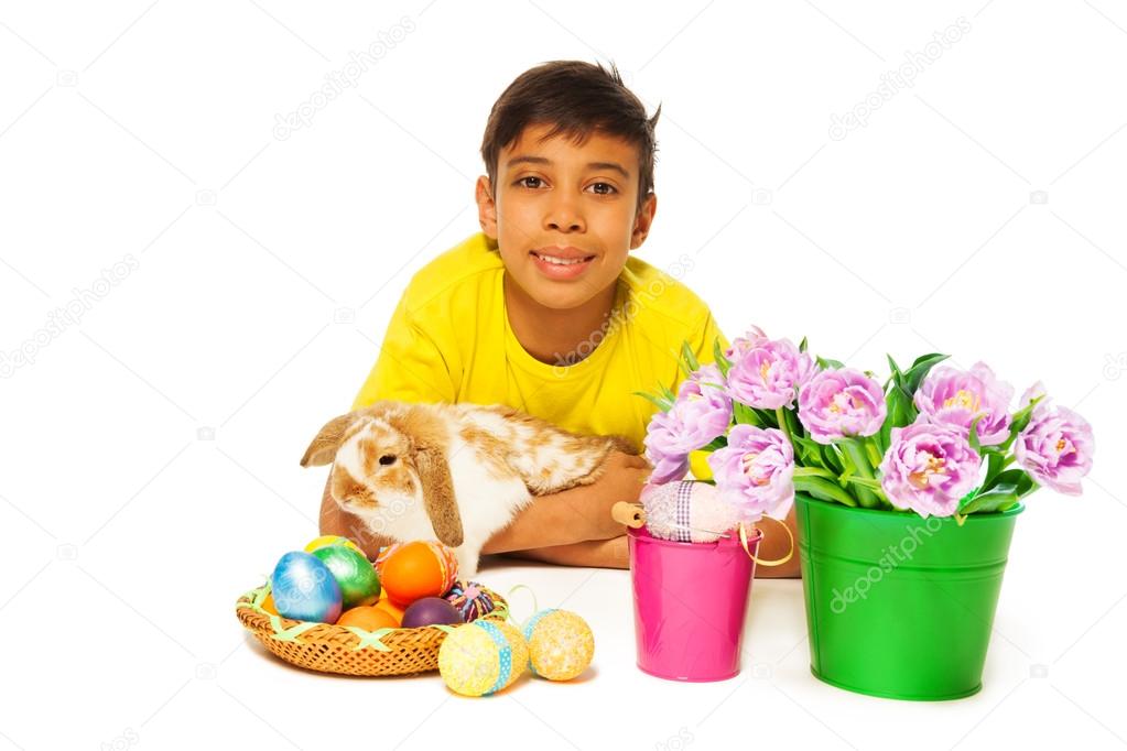 Boy hugging Eastern rabbit Stock Photo by ©serrnovik 47611289