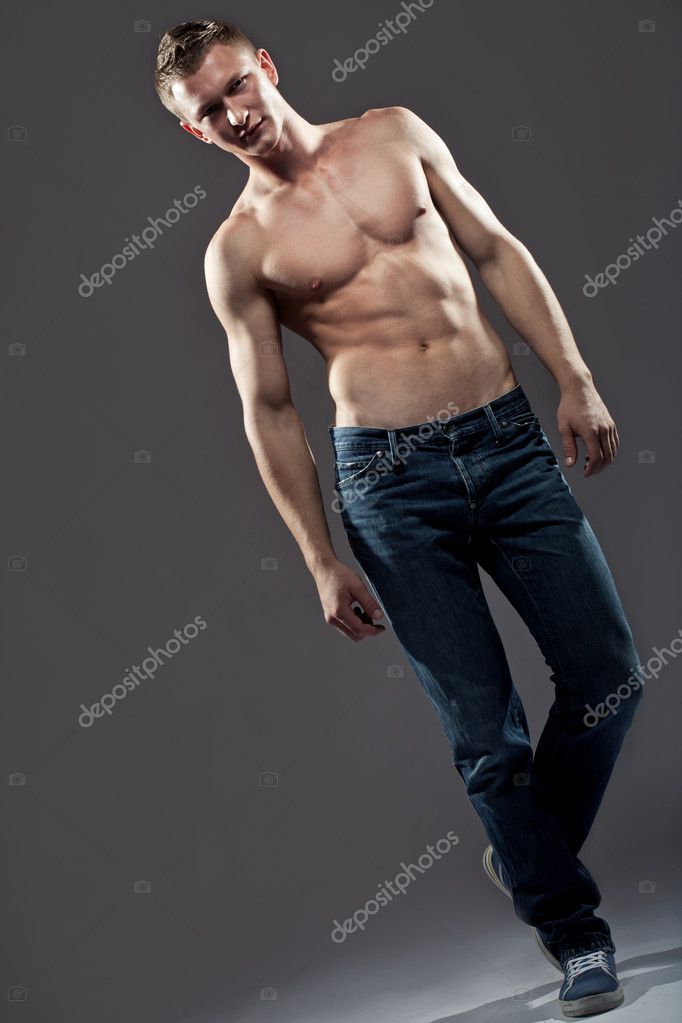 Sexy macho shirtless man with a muscular body — Stock Photo © chesterf ...