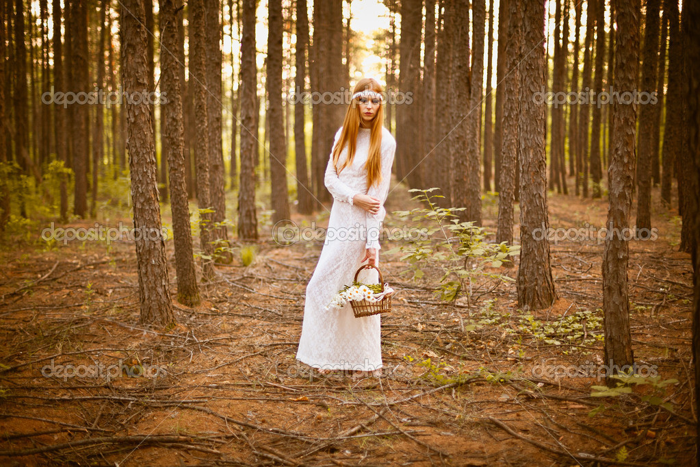 Beautiful woman standing in forest — Stock Photo © chesterf #14171647