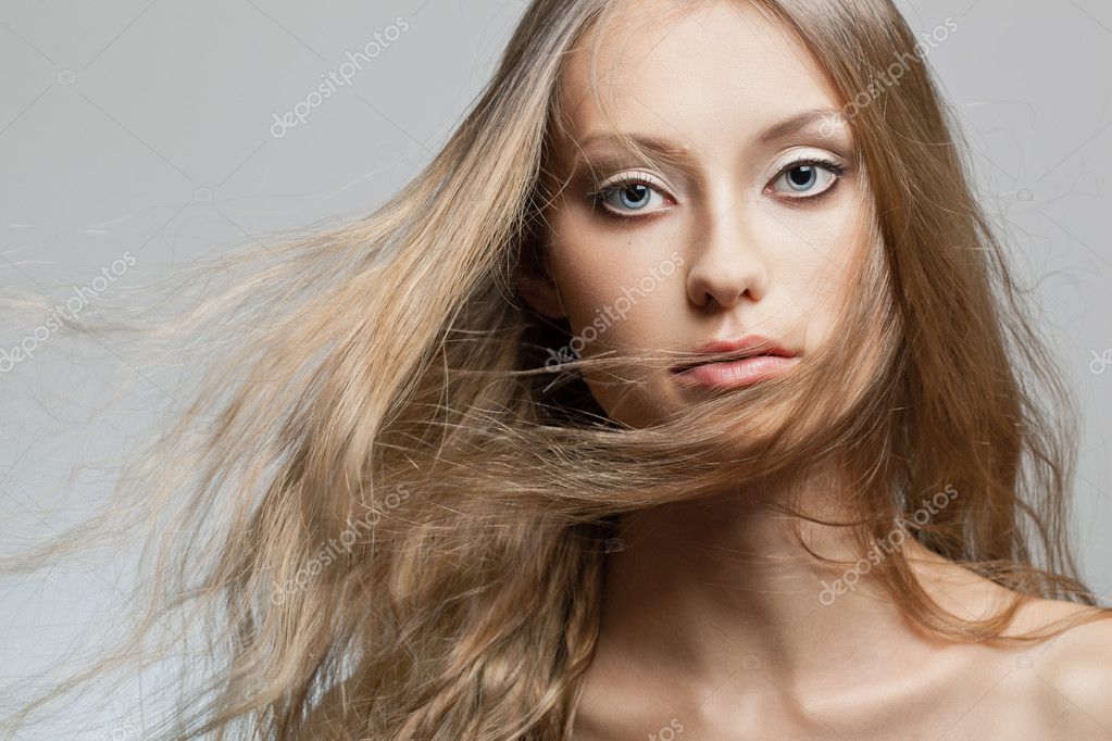 Woman face portrait with flying hair Stock Photo by ©chesterf 15597575