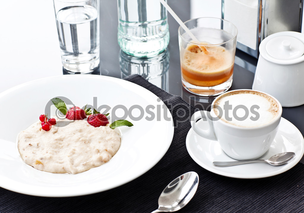 Semolina porridge in a plate with fresh strawberries. Health Breakfast ...