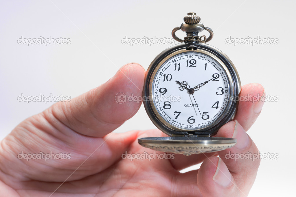 Pocket watch in hand Stock Photo by ©jackchen 32640125