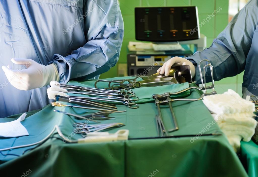 Surgeons and surgical tools — Stock Photo © amoklv #13533024