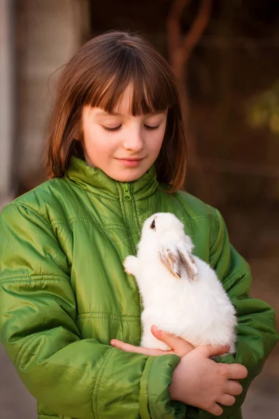 Child holding rabbit Stock Photos, Royalty Free Child holding rabbit ...