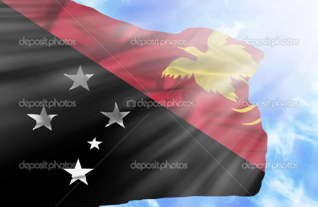 Papua New Guinea waving flag against blue sky with sunrays Stock Photo ...