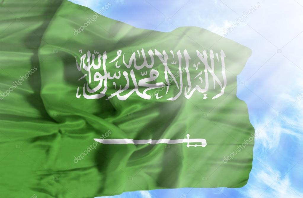 Saudi Arabia waving flag against blue sky with sunrays — Stock Photo ...
