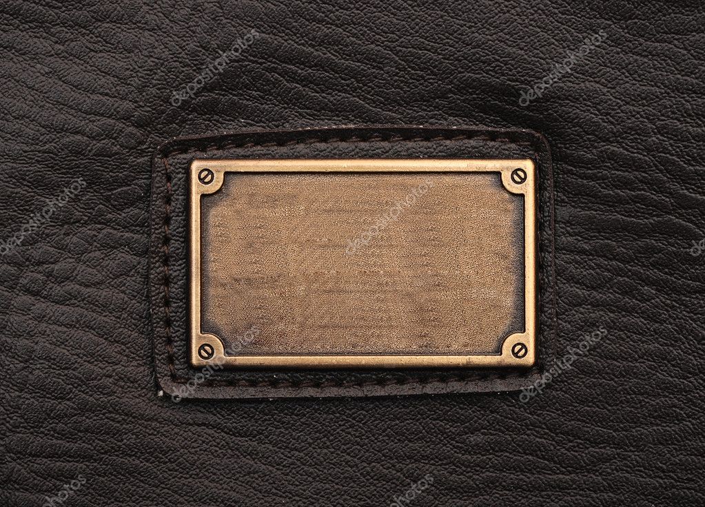 Metal label on old black leather background Stock Photo by ©inxti74 ...