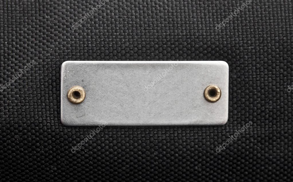 Blank metal label on old black background — Stock Photo © inxti74 #39606951