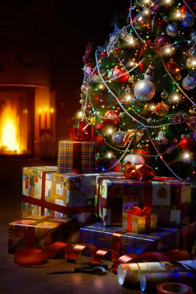Art Christmas scene with tree gifts and fire in background Stock Photo ...