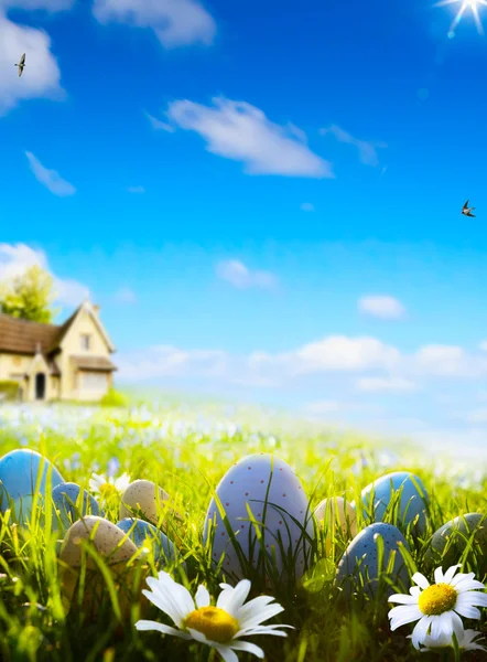 Art Easter eggs decorated with flowers in the grass on blue sky Stock ...
