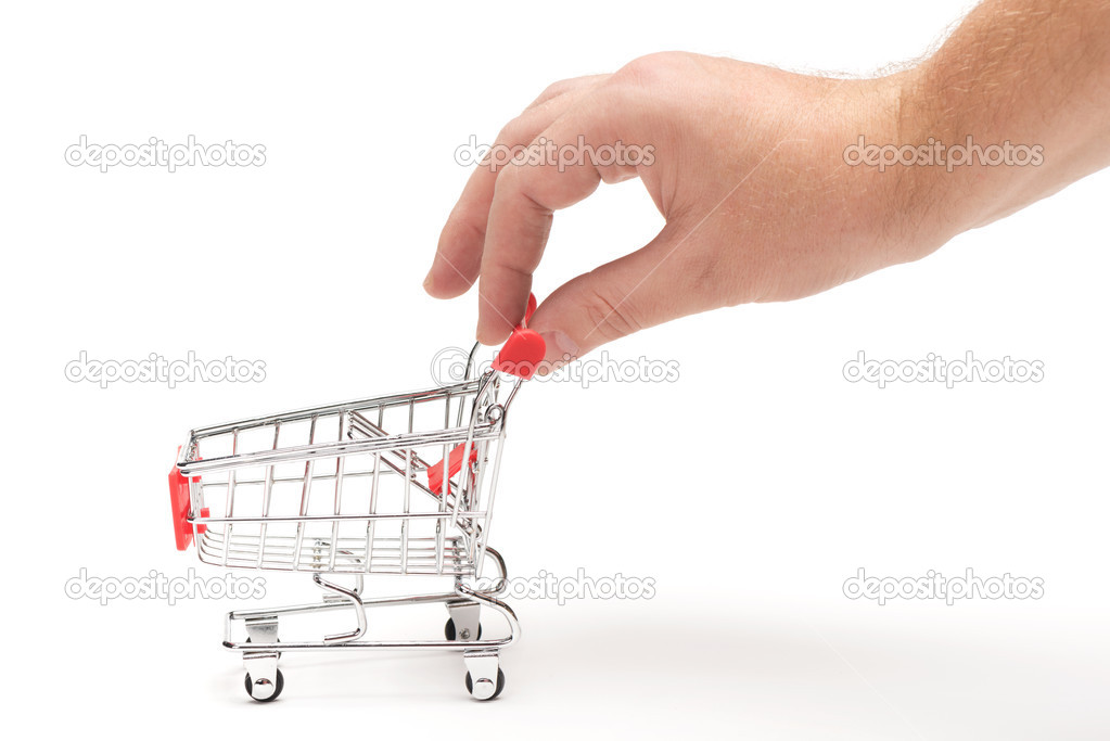 Hand pulling shopping cart Stock Photo by ©pavel_kolotenko 36241625
