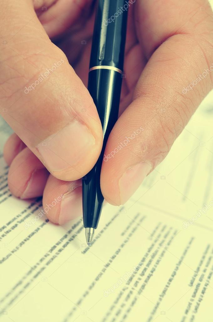 Man hand with a pen, with a retro filter effect Stock Photo by ©nito103 ...