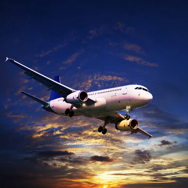 Jet plane in a sunset sky — Stock Photo © vladmoses #8647351