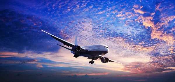 Jet plane in a sunset sky — Stock Photo © vladmoses #8647351