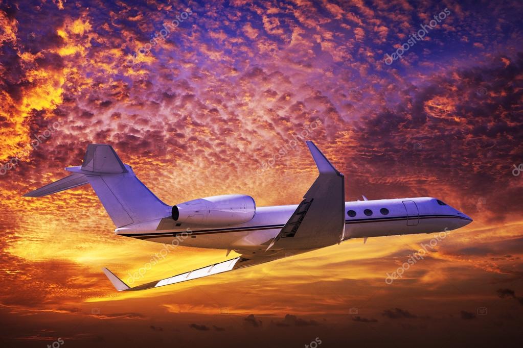 Private jet cruising in a sunset sky — Stock Photo © vladmoses #35902451