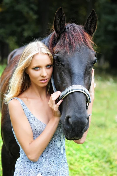 Portrait of yang and pretty female horse rider - Stock Image - Everypixel