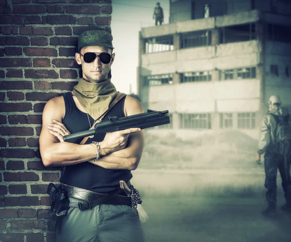Military man with gun - automatic - Stock Image - Everypixel